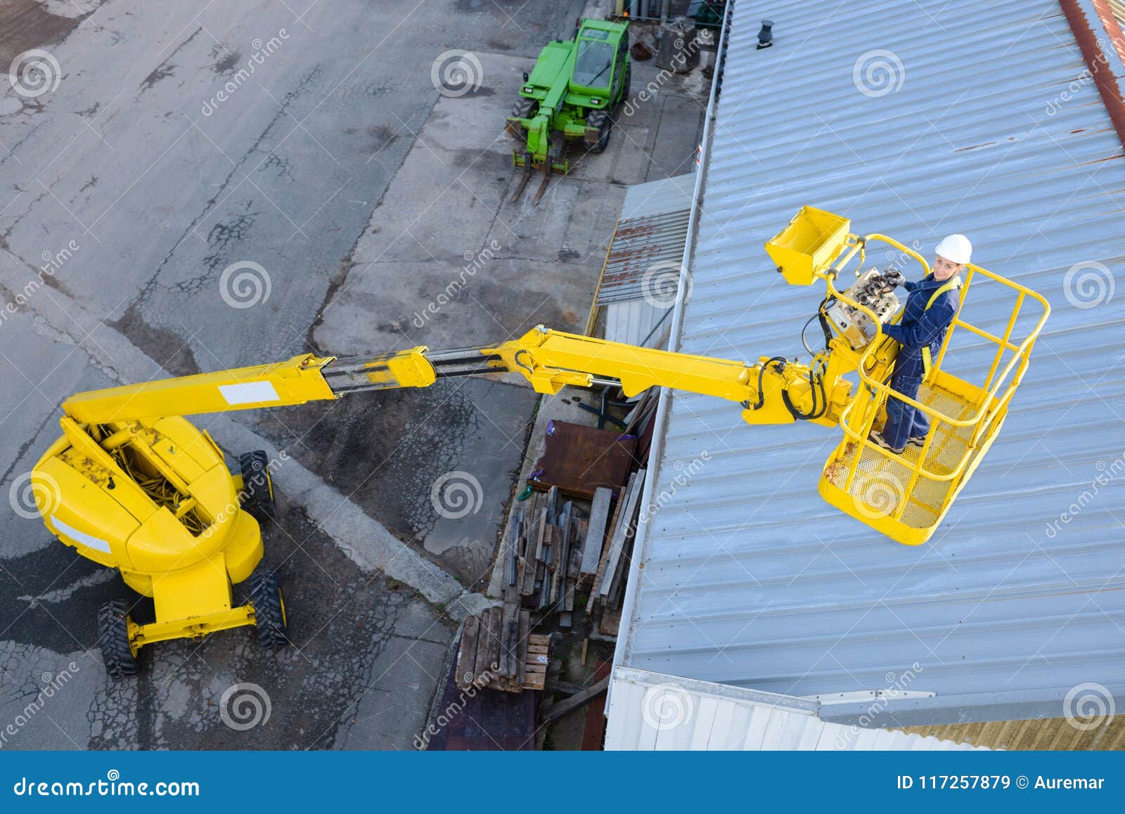Looking Down on Woman in Cherry Picker Stock Image - Image of yellow ...