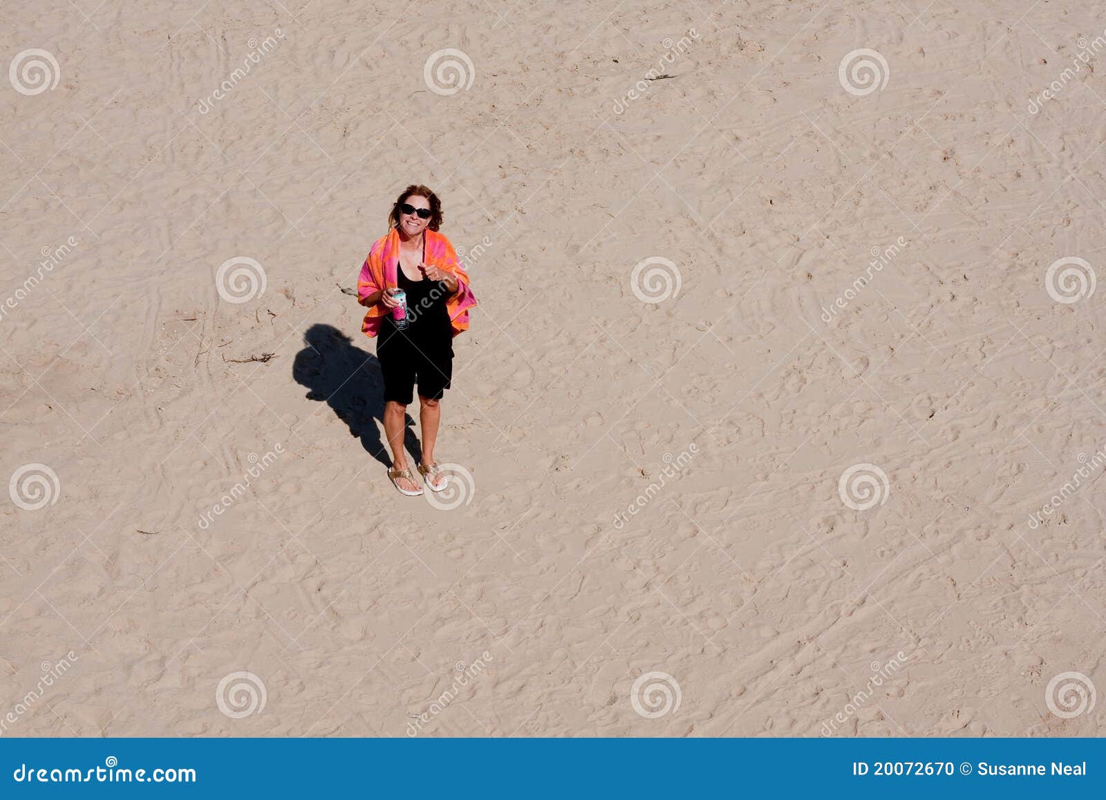 Looking Down at a Woman Standing in Sand Stock Photo - Image of view ...