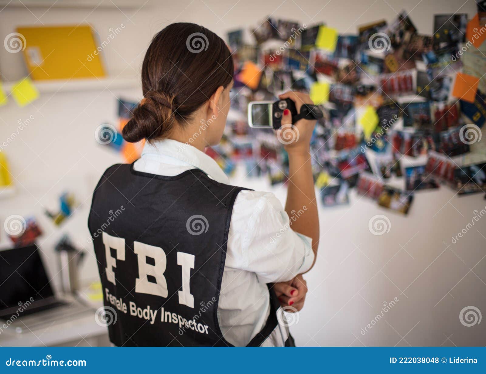 Looking for Evidence. FBI Woman Works on a Case. Using Camera Looking ...