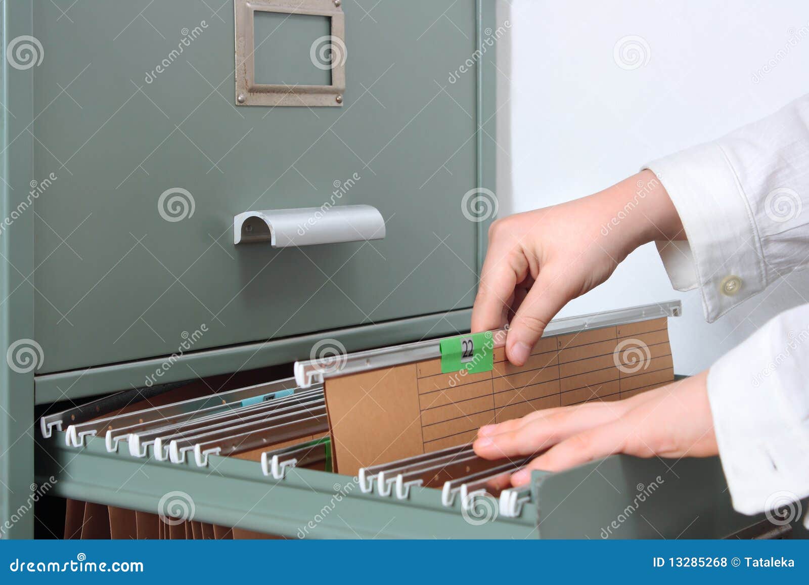 Looking through the files stock photo. Image of searching - 13285268