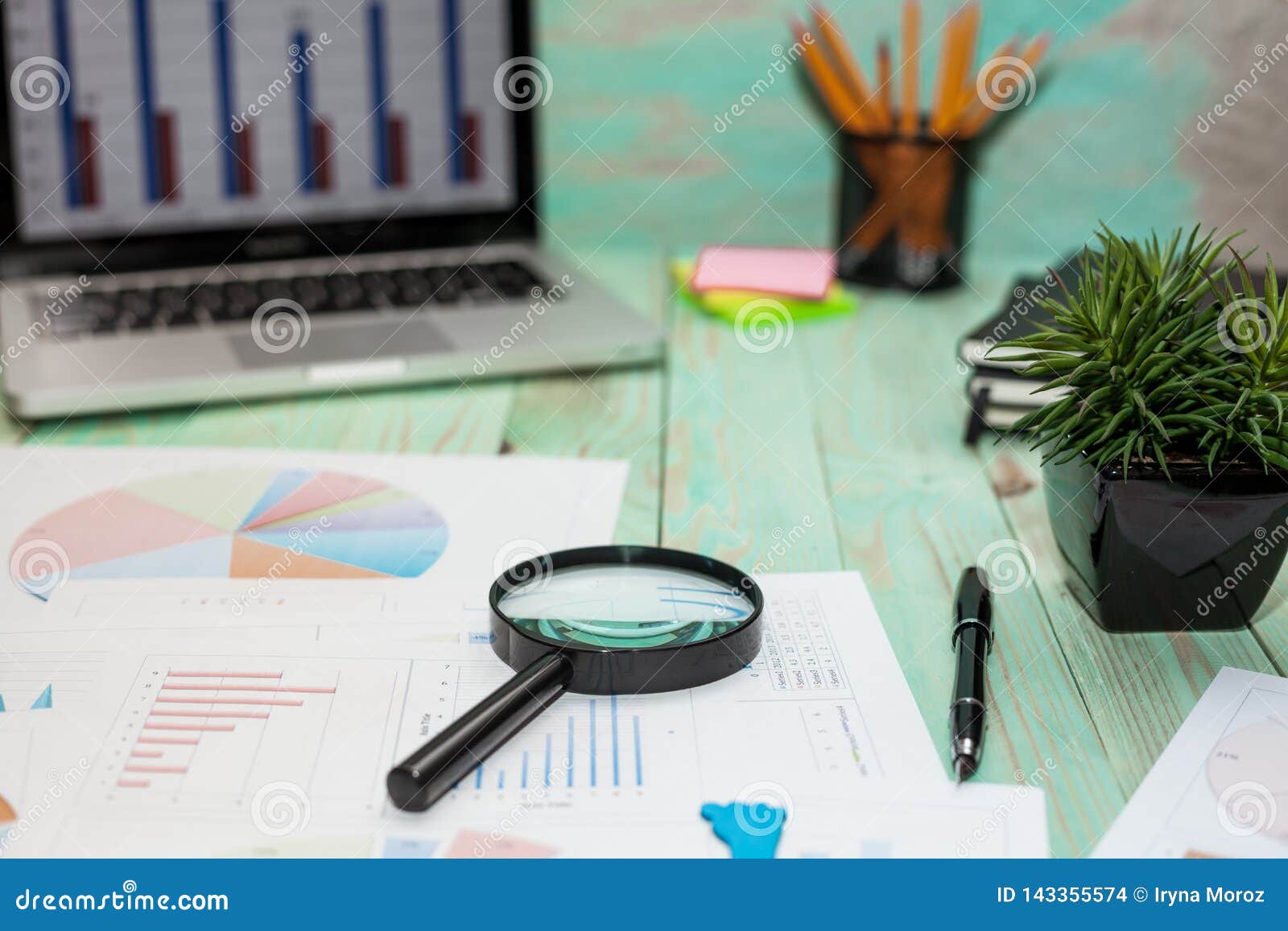 Looking at Growth Chart with Magnifying Glass. Graphs, Charts and ...