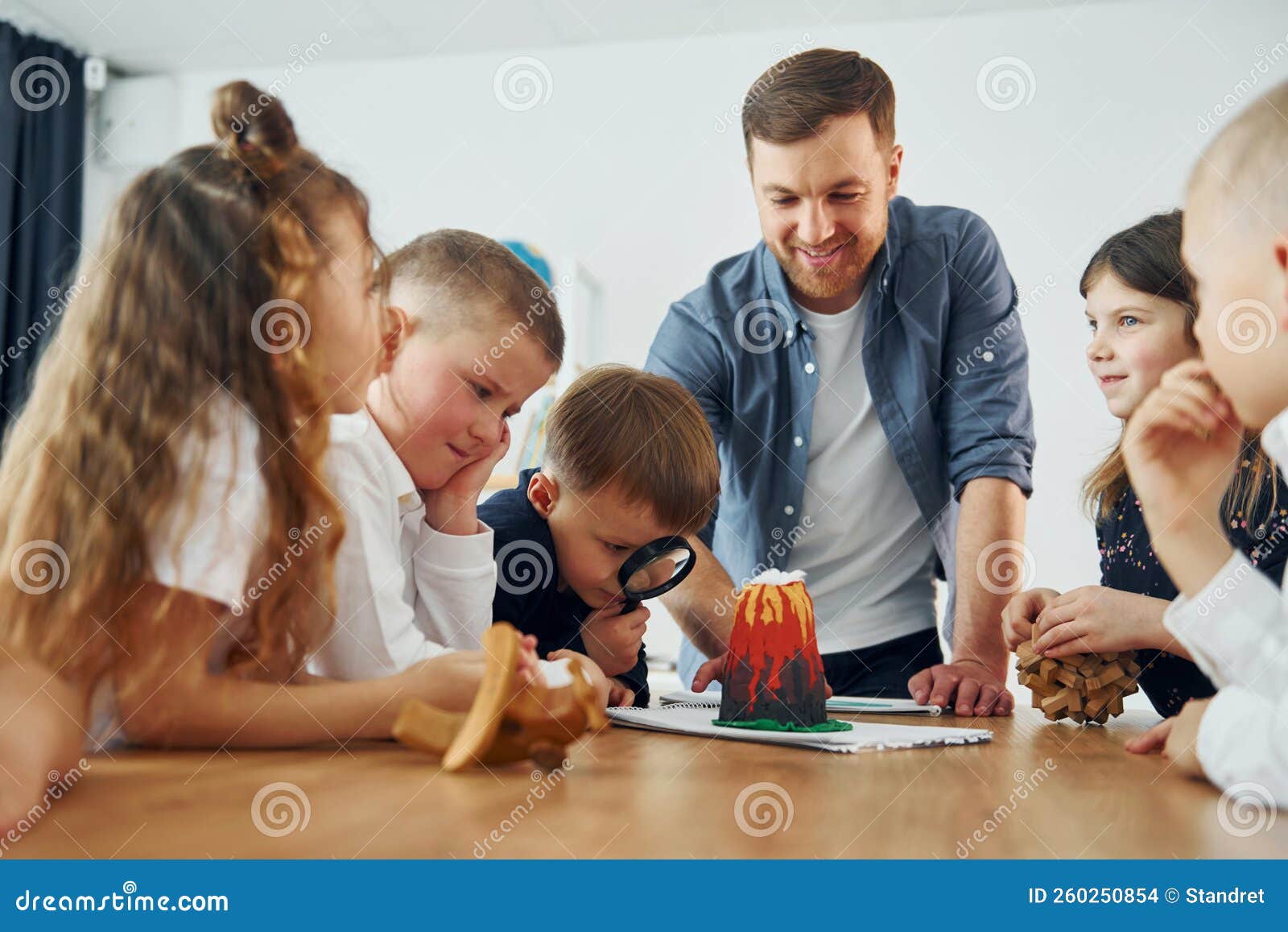 Looking at the Model of Volcano. Group of Children Students in Class at ...