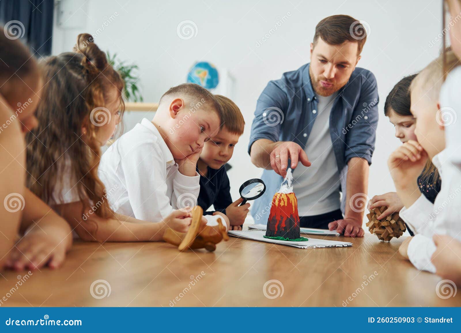 Looking at the Model of Volcano. Group of Children Students in Class at ...