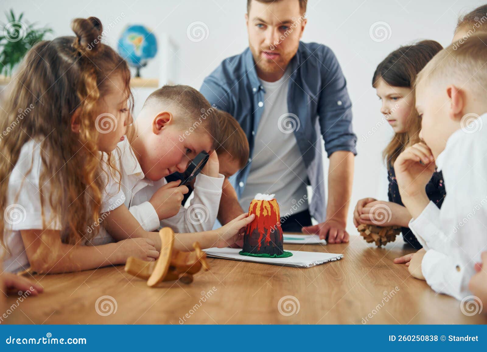 Looking at the Model of Volcano. Group of Children Students in Class at ...