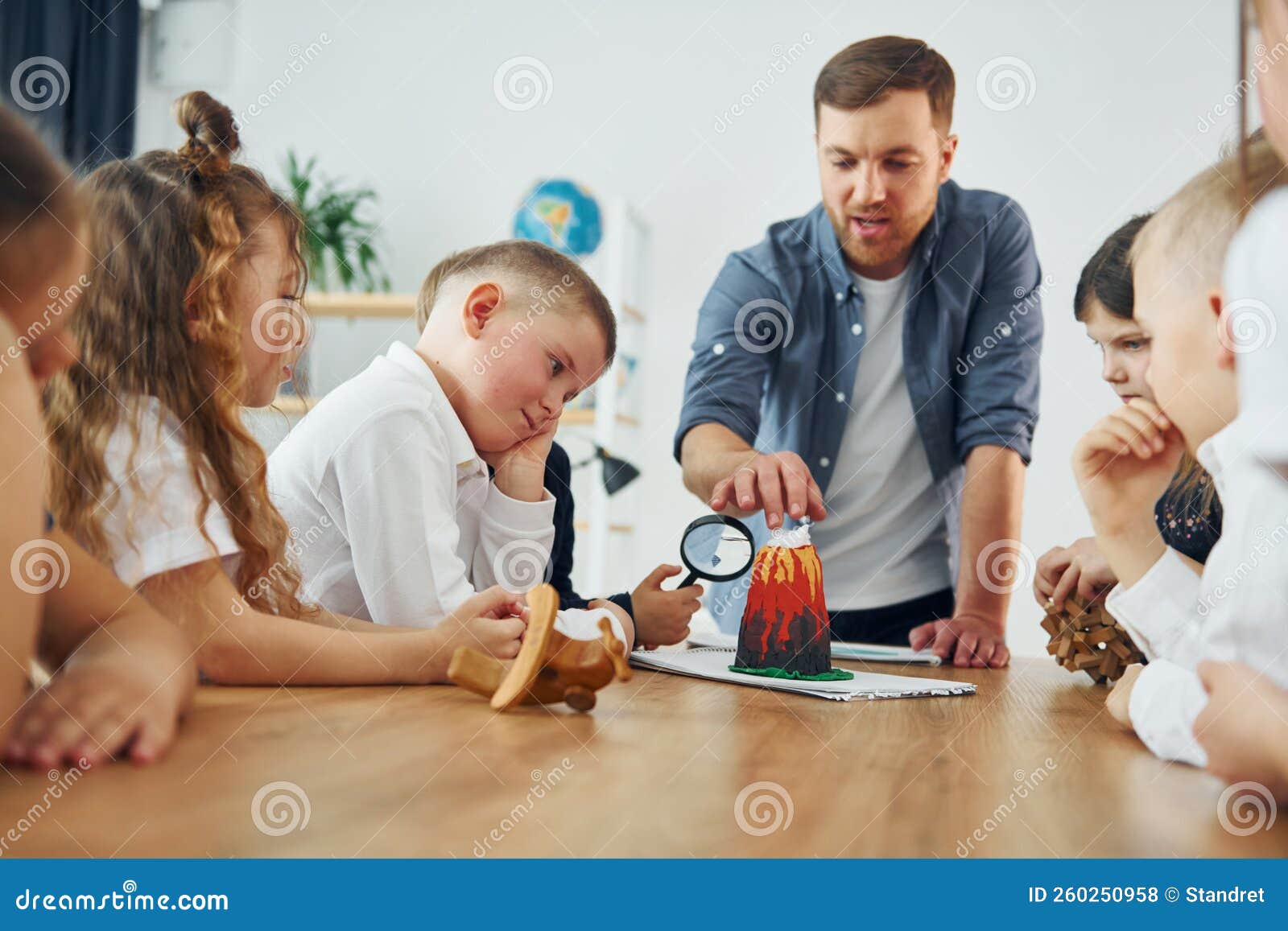 Looking at the Model of Volcano. Group of Children Students in Class at ...