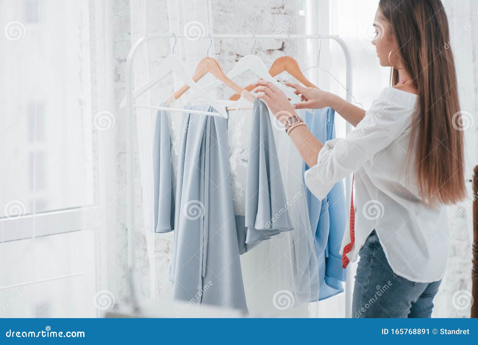 Looking for the Needed Cloth. the Process of Fitting the Dress in the ...