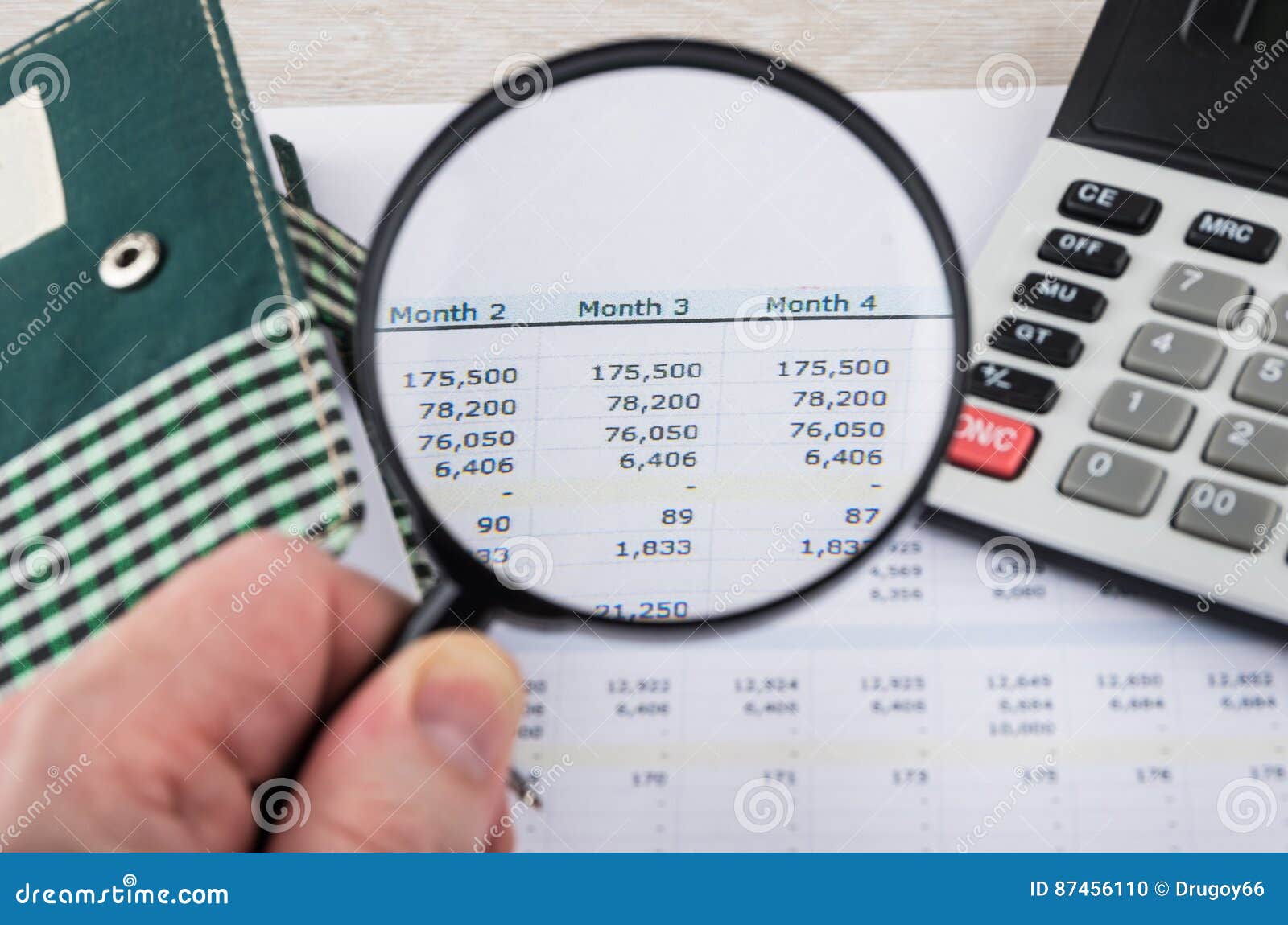 Looking Numbers on Printout with Magnifying Glass Stock Photo - Image ...