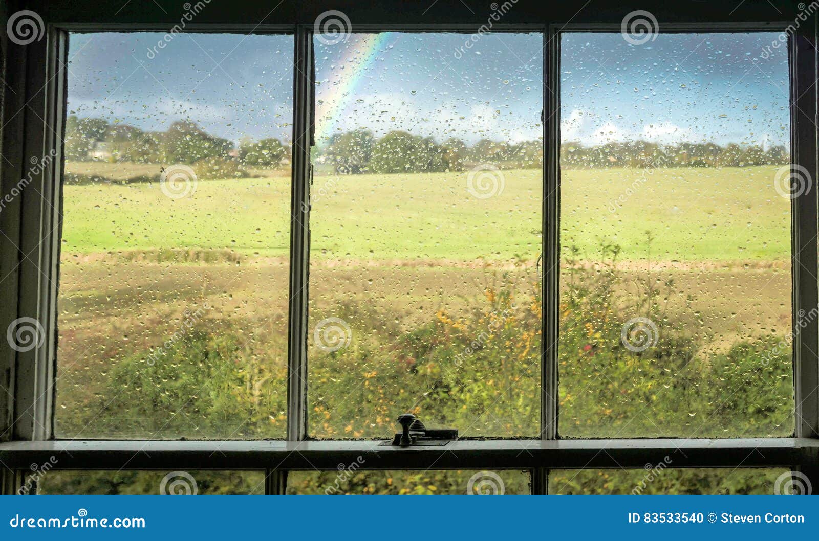 Looking out to a rainbow stock photo. Image of street - 83533540