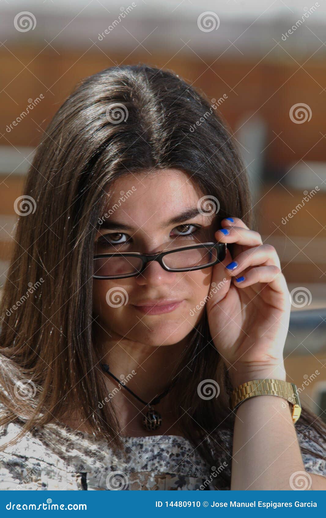 Looking over the glasses stock photo. Image of female - 14480910