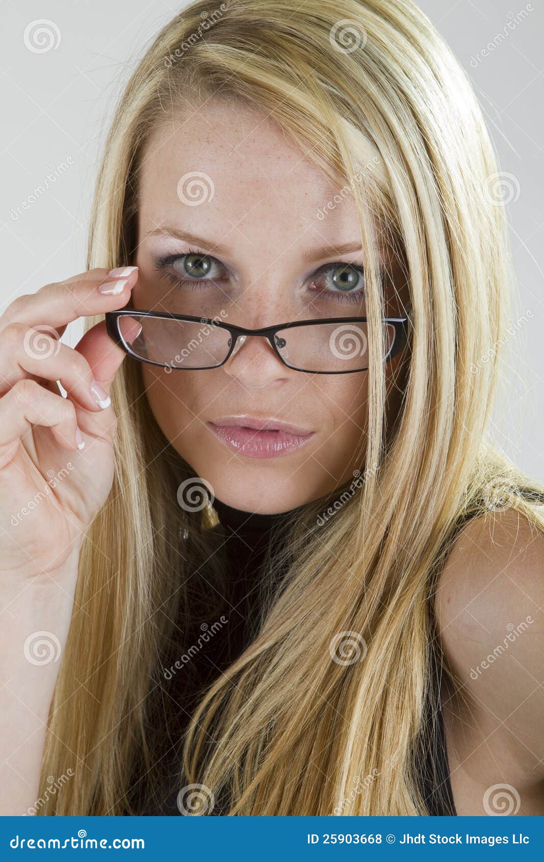 Looking over her glasses stock photo. Image of blond - 25903668