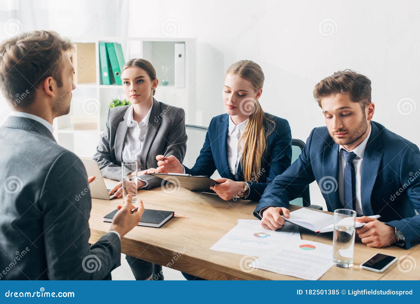 Looking at Papers during Job Interview with Employee in Office Stock ...