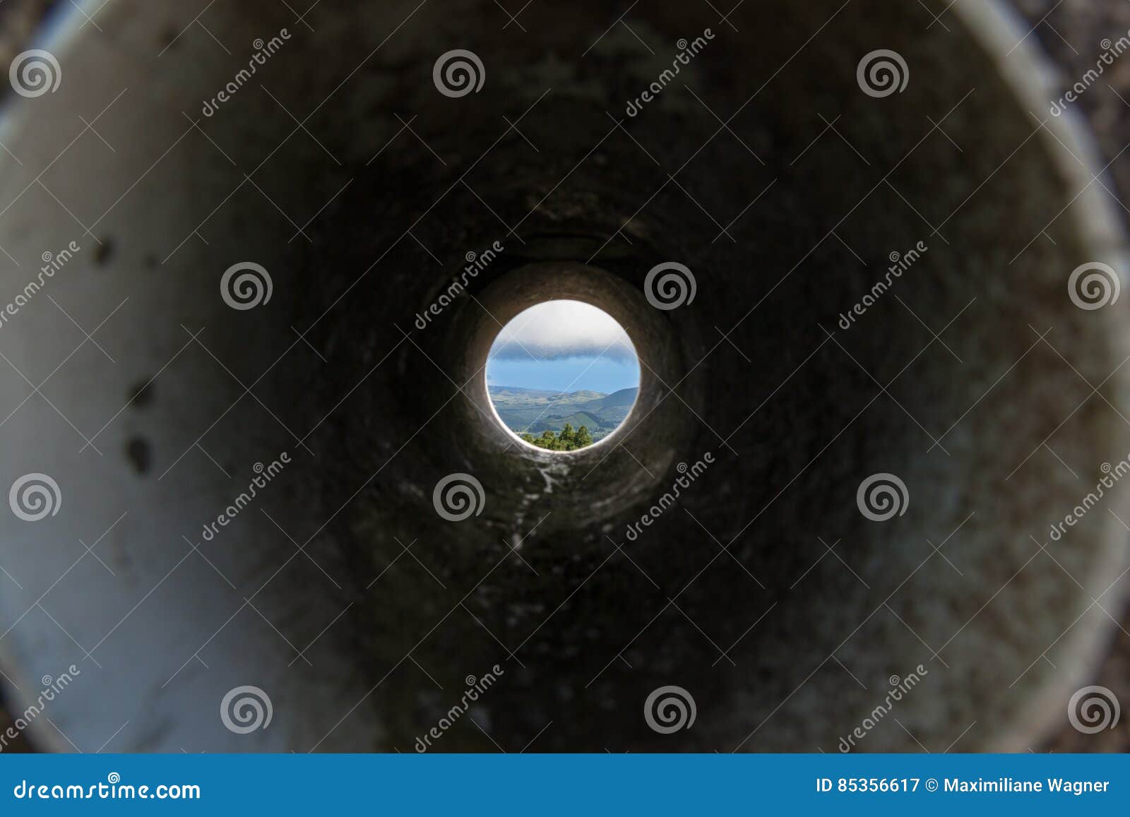 Looking through Pipe at Landscape with Hills and Ocean Stock Image ...