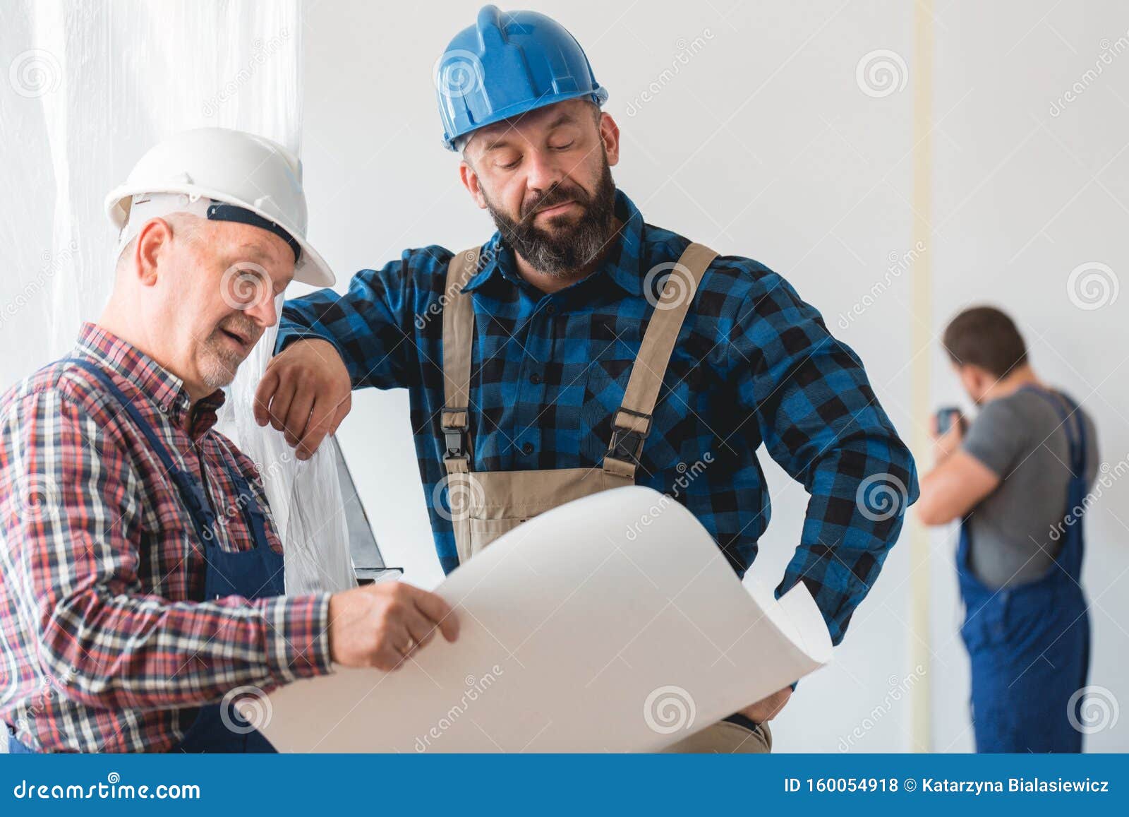 Looking at the plan stock photo. Image of blueprint - 160054918