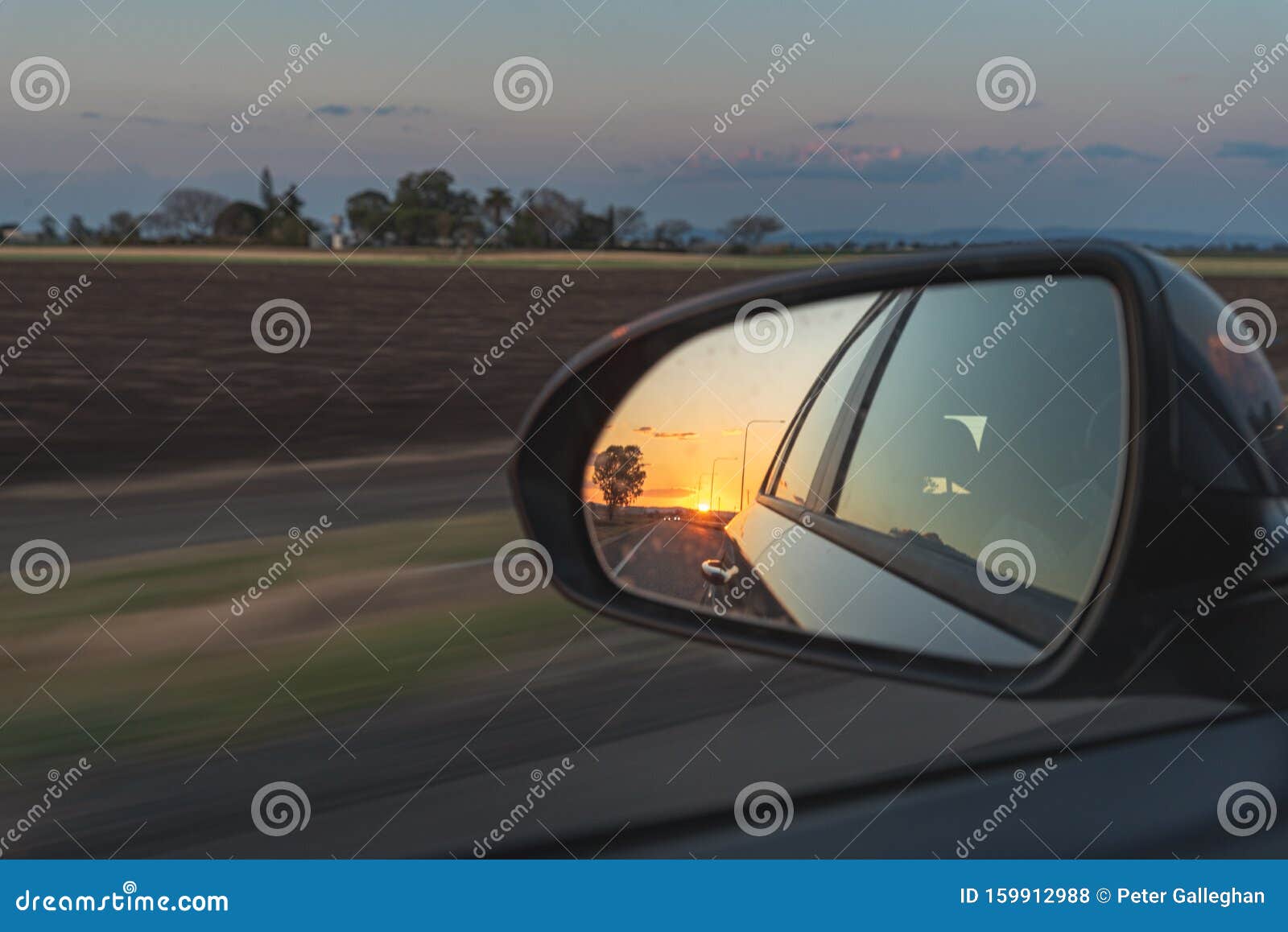 Looking through a Side Mirrors with a Sunset in it Stock Photo - Image ...