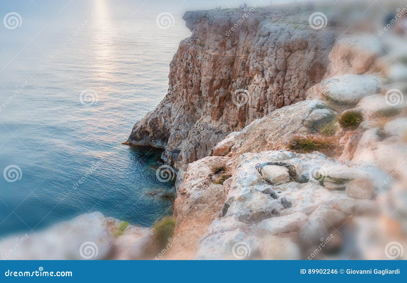 Looking at Sunset Over a Cliff Stock Photo - Image of dusk, scenery ...