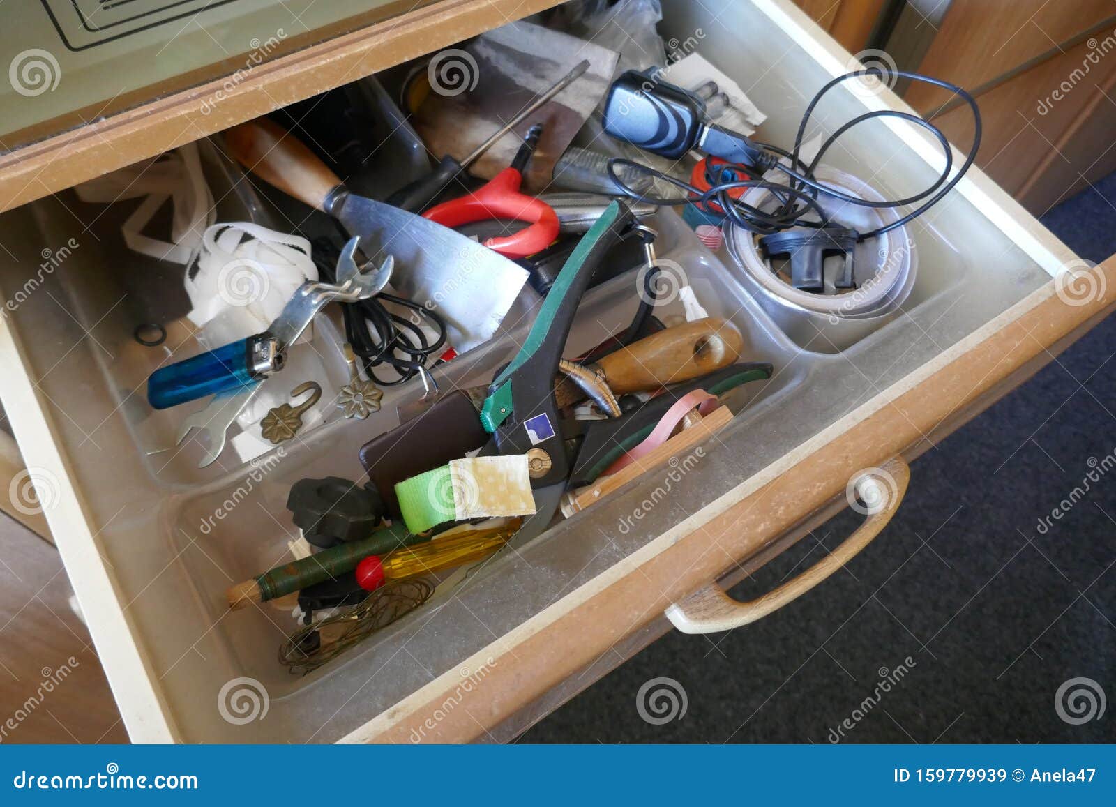 Looking into a Untidy Drawer. Messy Drawer with Tools, Household Items ...