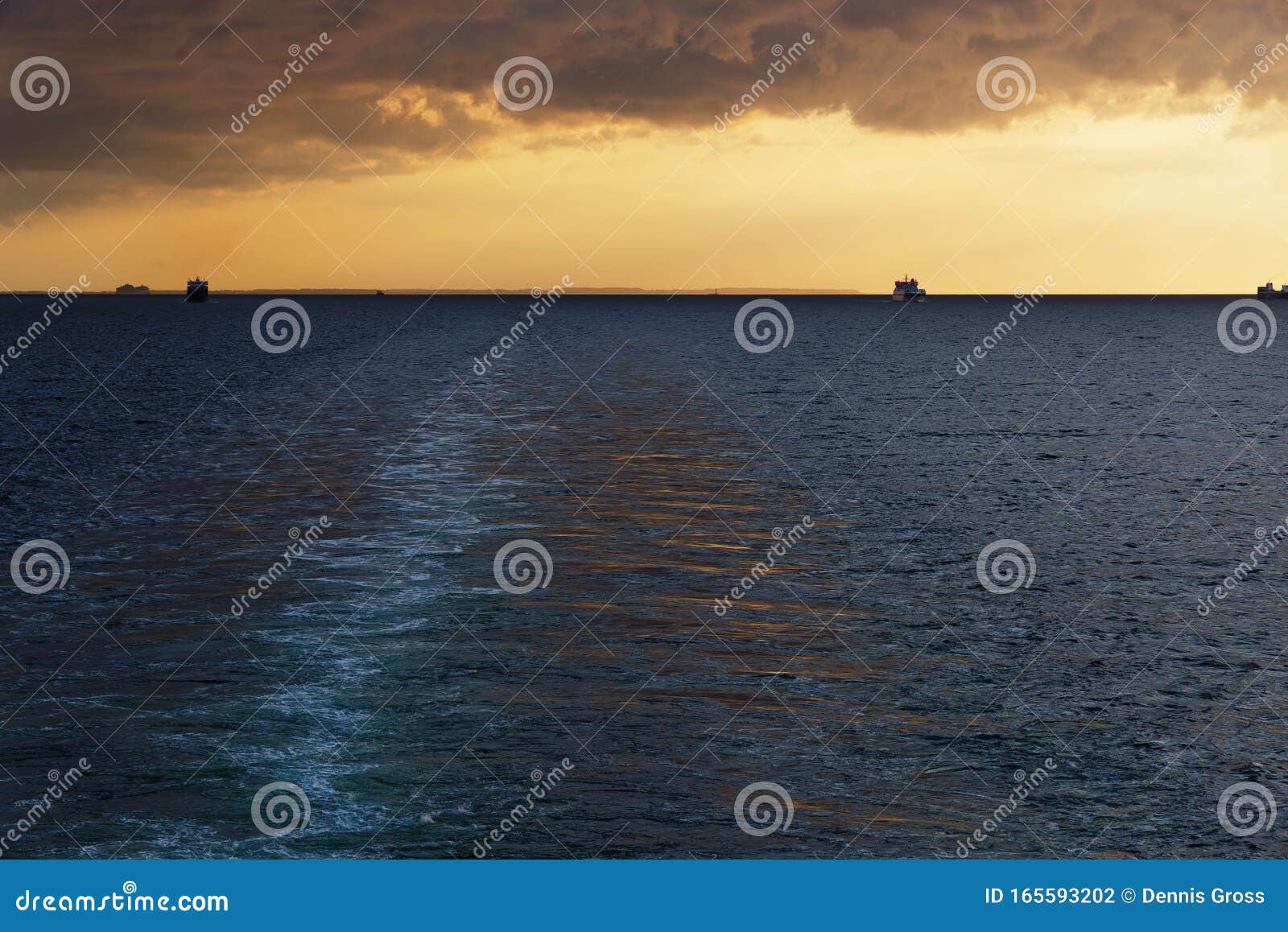 Wake of a Cruise Ship Against Golden Sunset at Horizon Stock Photo ...