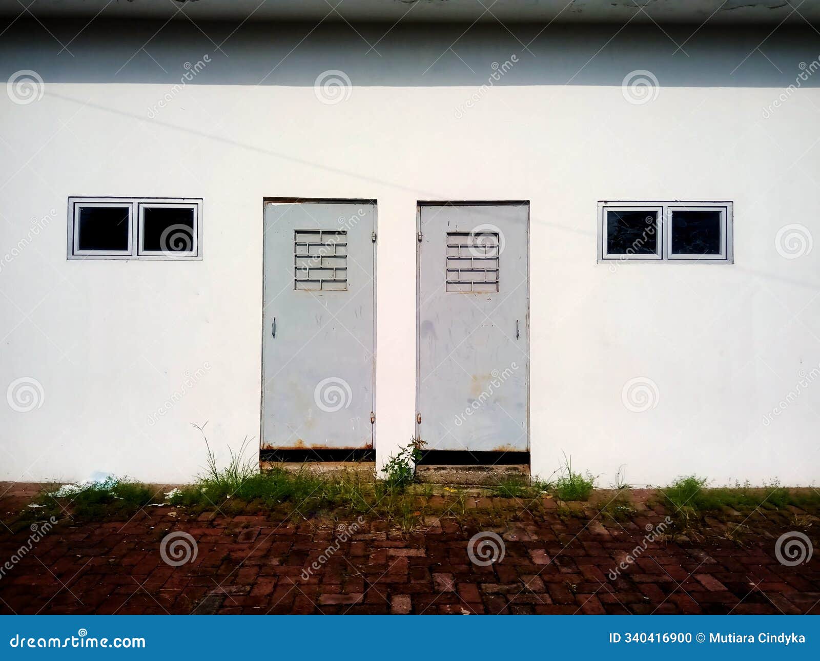 Two Doors and Two Small Windows. Stock Photo - Image of building ...