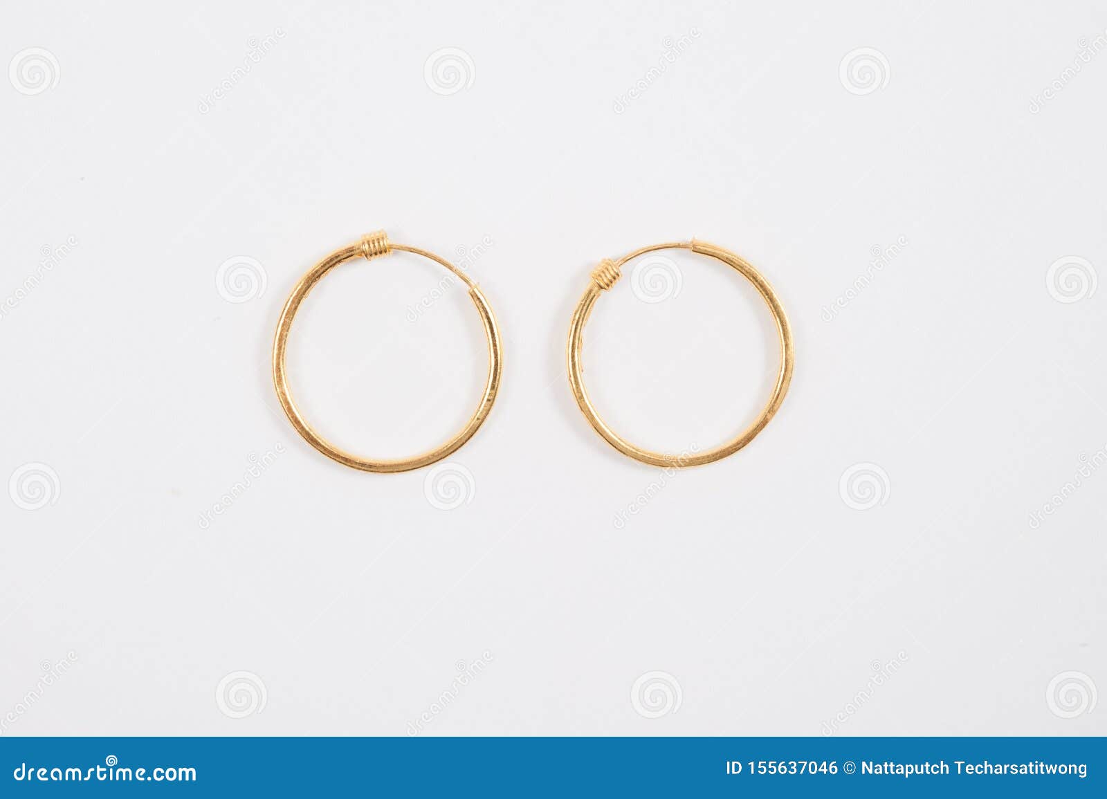 Loop gold earrings stock photo. Image of attractive - 155637046