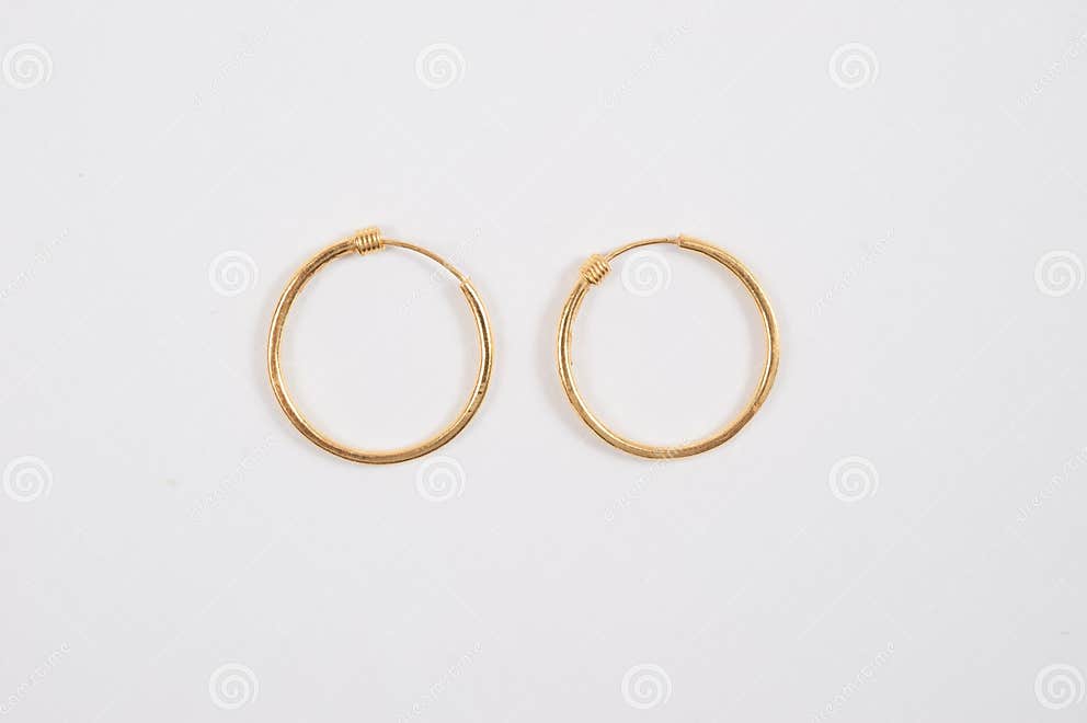 Loop gold earrings stock image. Image of macro, fashion - 155637139