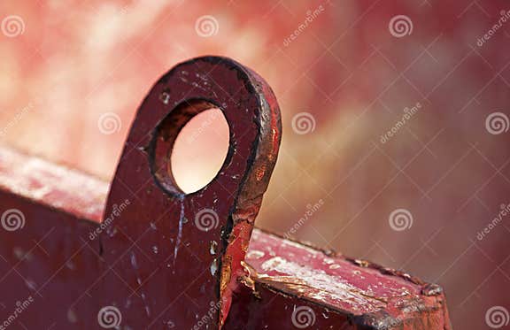 A Loop of Red Colored Metal with a Blurred Background Stock Image ...