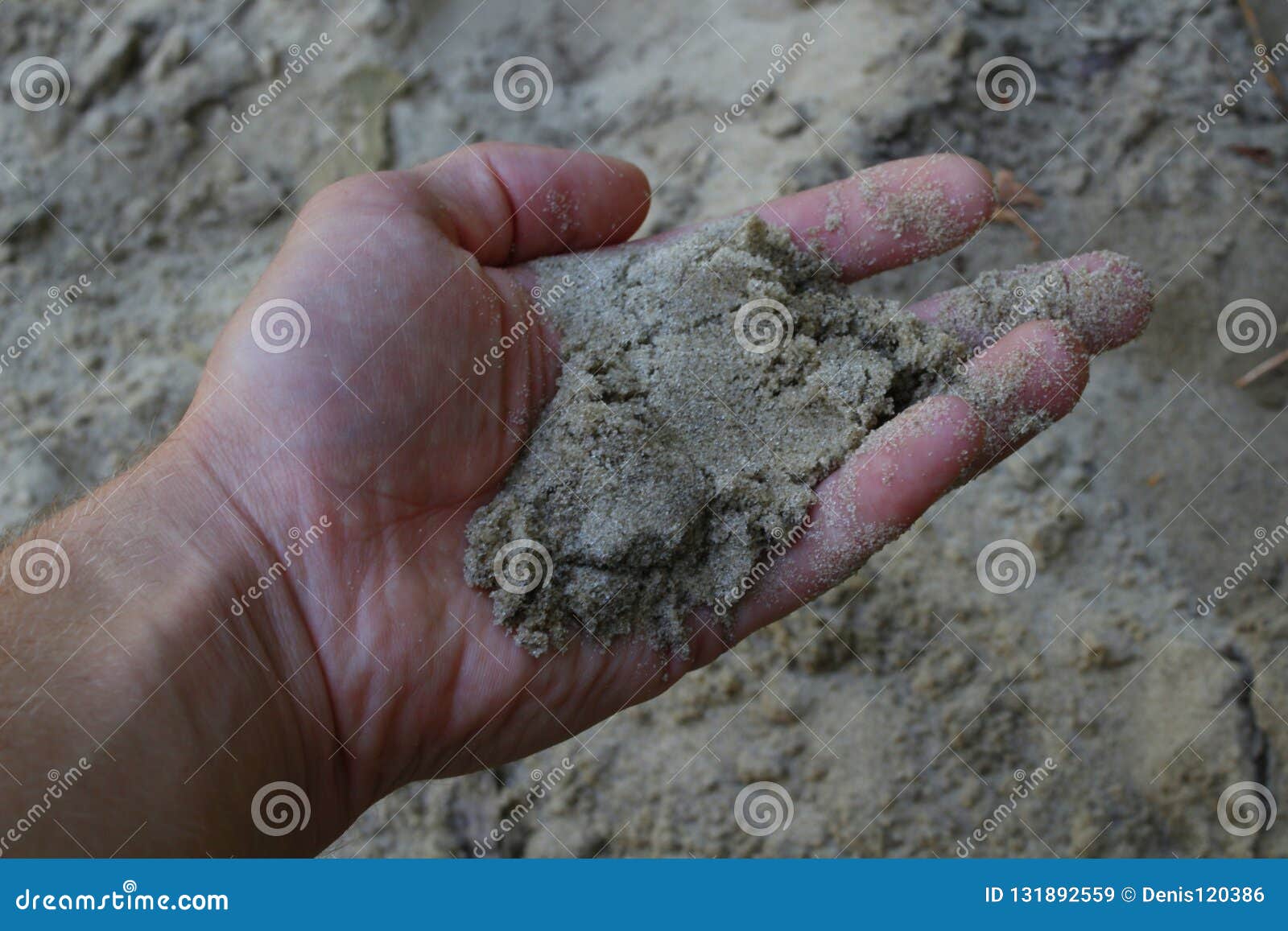 Sand in hand stock image. Image of sand, hand, hands - 131892559