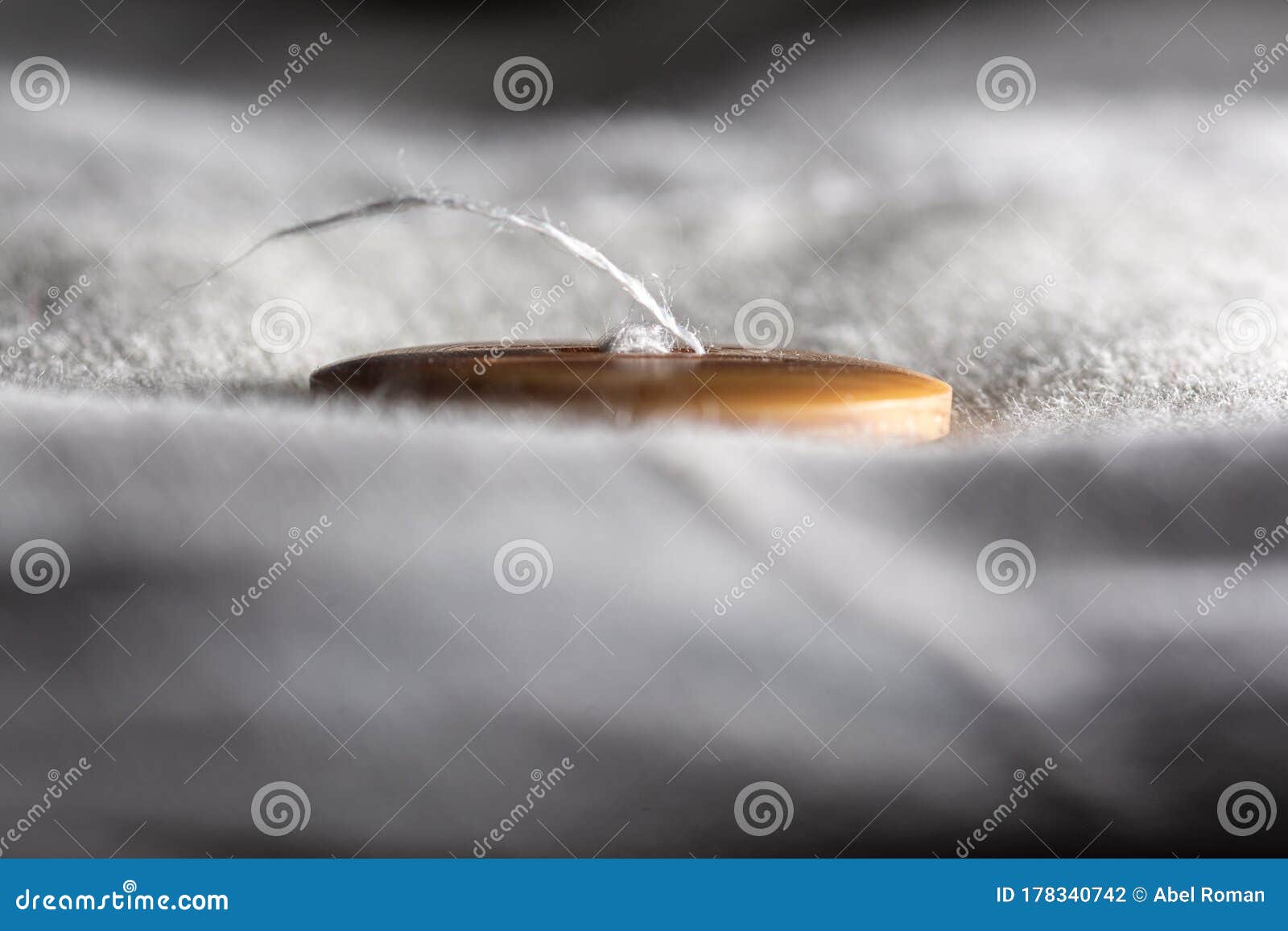 Loose Thread in the Seam of a Button on a Bedspread Stock Photo - Image ...