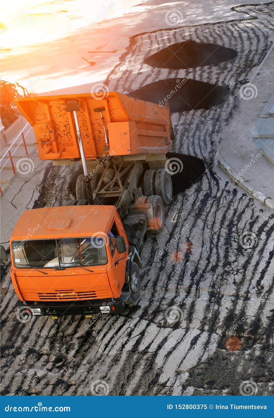The Lorry of Orange Color Unloads Cement on the Road. Stock Image ...