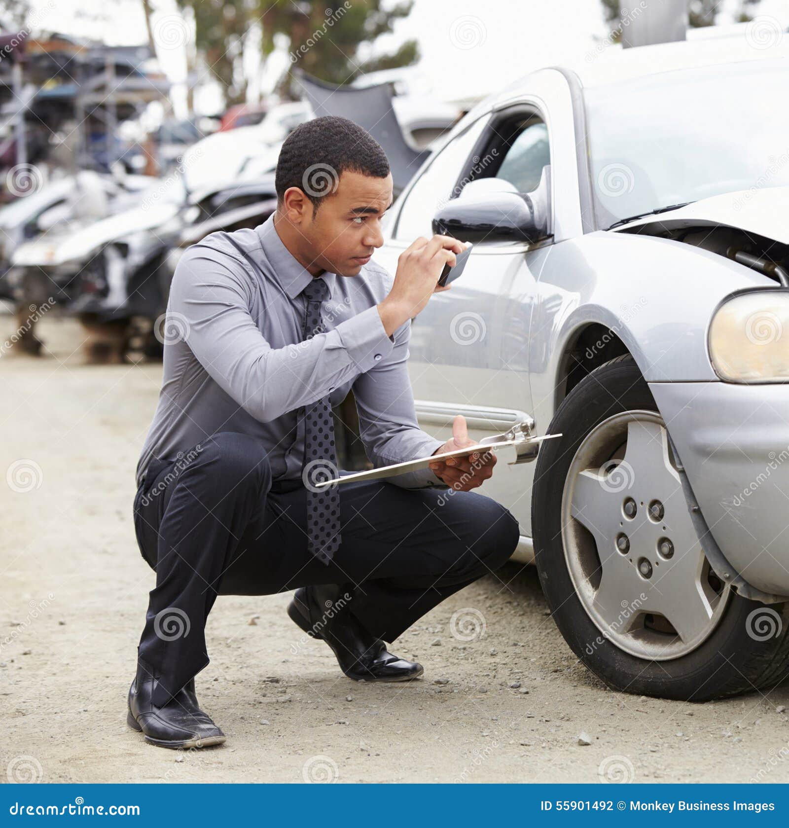 Loss Adjuster Taking Photograph of Damage To Car Stock Photo - Image of ...