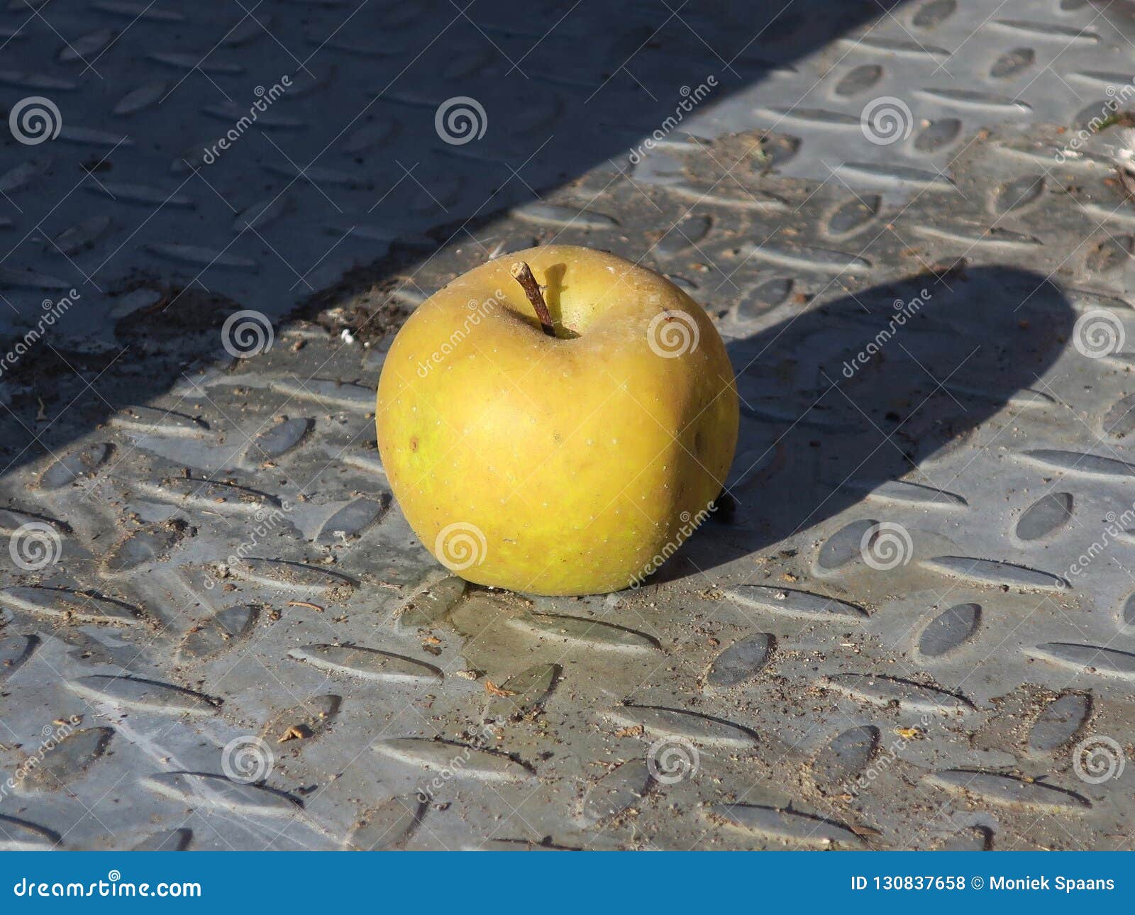 Lost Apple Laying Down on a Dirty Tear Plate Stock Photo - Image of ...