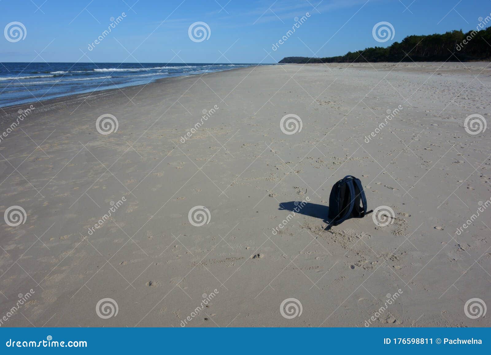 Lost Backpack on an Empty Beach Stock Image - Image of pebbles, waves ...