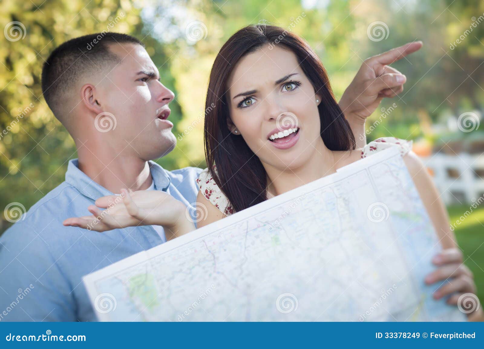 Lost and Confused Mixed Race Couple Looking Over Map Outside Stock ...