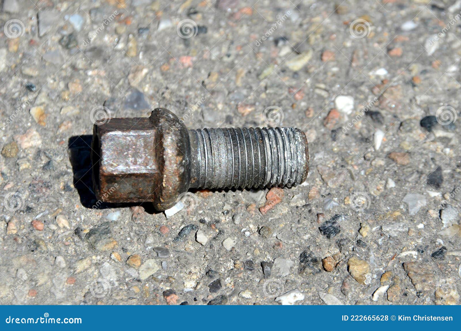 Lost Wheel Bolt from a Car on the Road Stock Photo - Image of danger ...