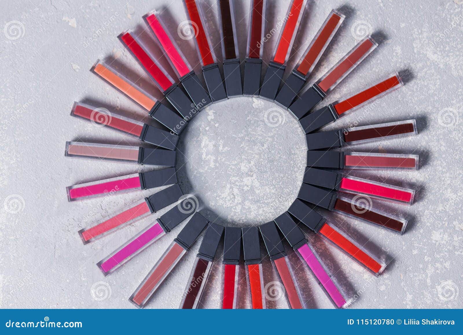 A Lot of Colored Lipsticks, Spread Out in a Circle on a Light Grey ...
