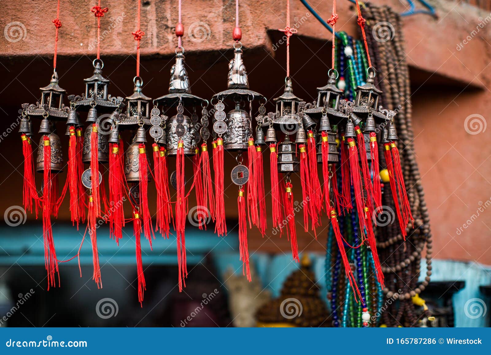 Lot of Decorative Silver Bells with Red Threads Hanging in a Store ...