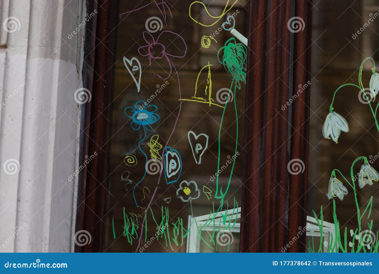 A Lot of Different Kids Drawings on the Windows of the House Stock ...