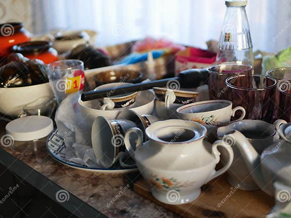 A Lot of Different Dishes on the Table. the Mess on the Table Stock ...
