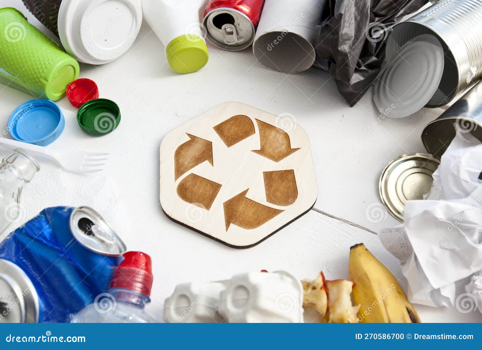 A Lot of Different Garbage on the Table and the Recycling Icon Stock ...