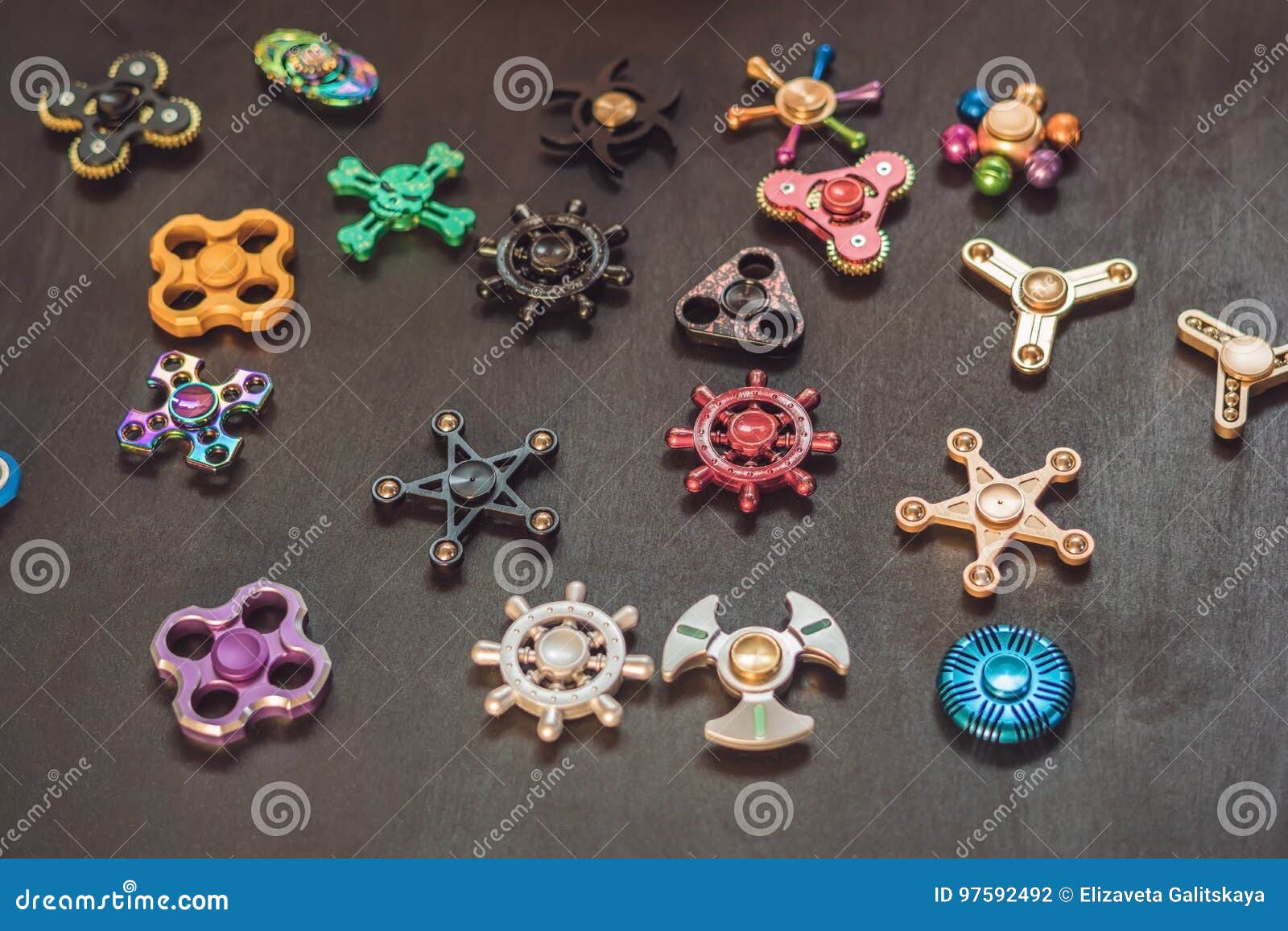 A Lot of Different Spinners on a Black Background Stock Photo - Image ...