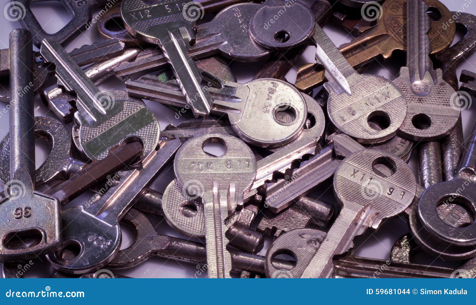 A Lot of Keys Different Sizes and Colours on the White Backgroun ...