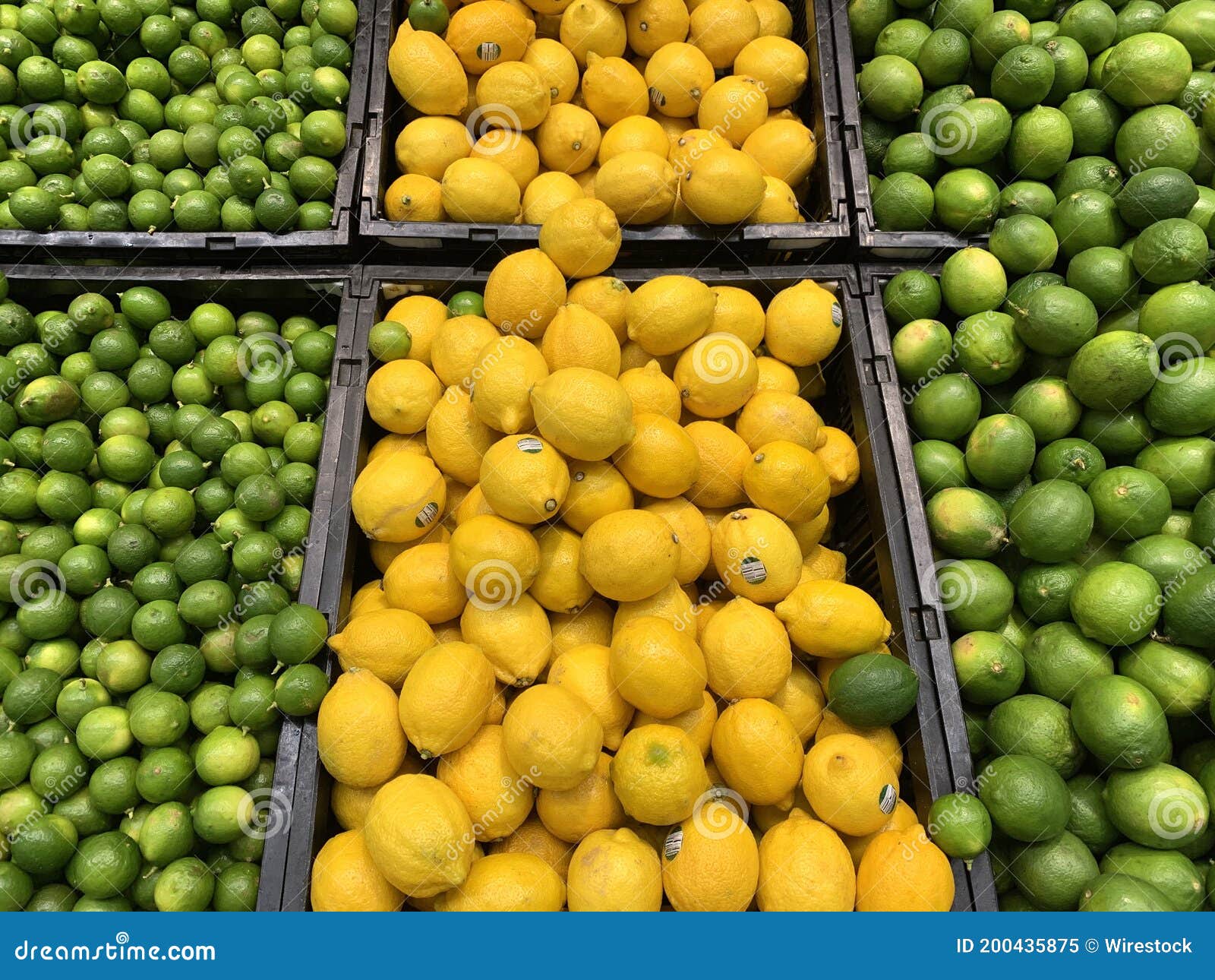 Lot of Lemons and Limes in Three Different Sizes in a Food Market Stock ...