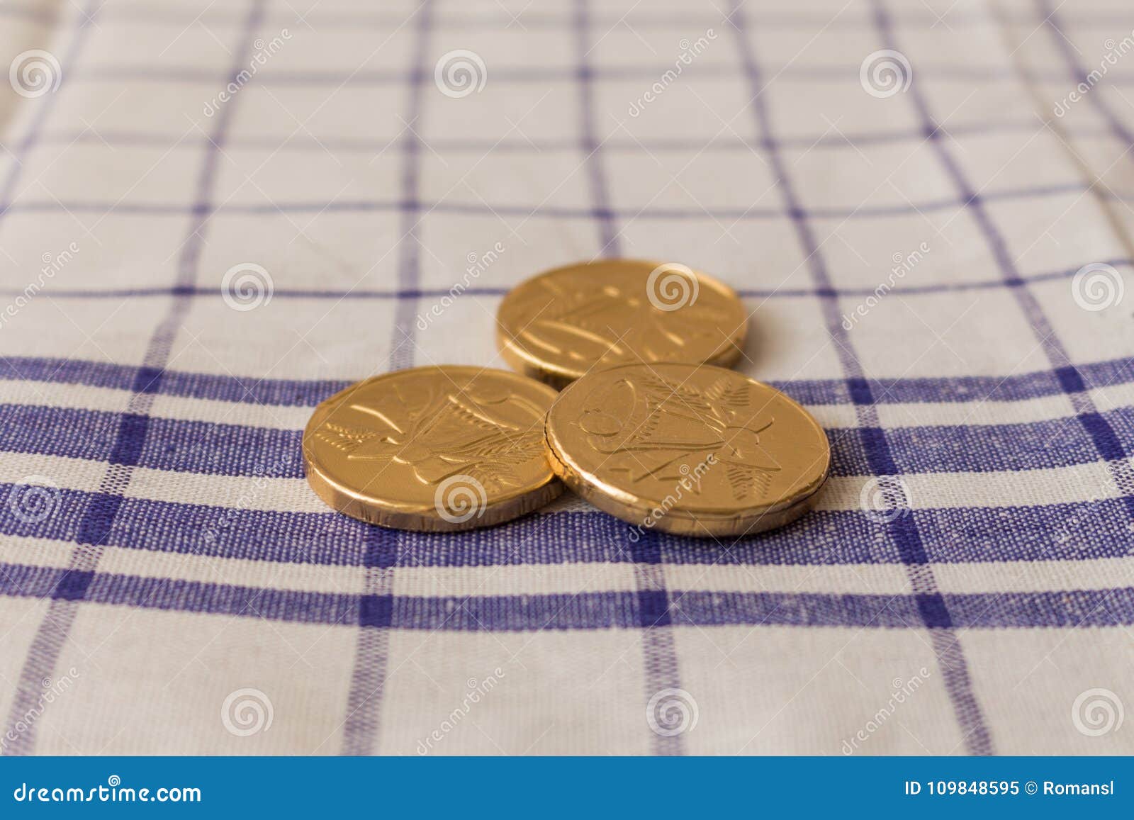 A Lot of Modern Coins with Bells. Coins with Square Pattern on Cloth ...