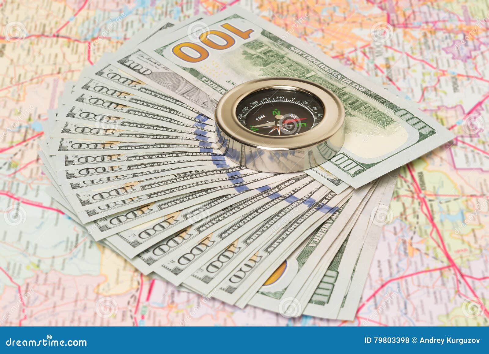 A Lot of Money on the Map Under the Compass Stock Photo - Image of line ...