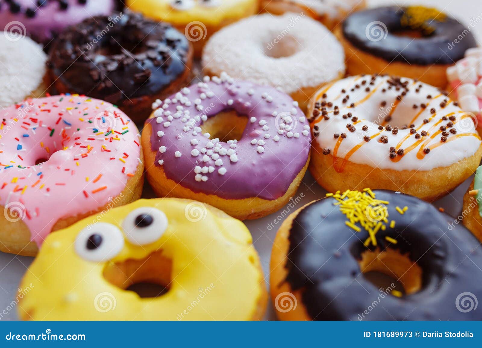 A Lot of Multi-colored Donuts with Different Fillings, Top View Stock ...