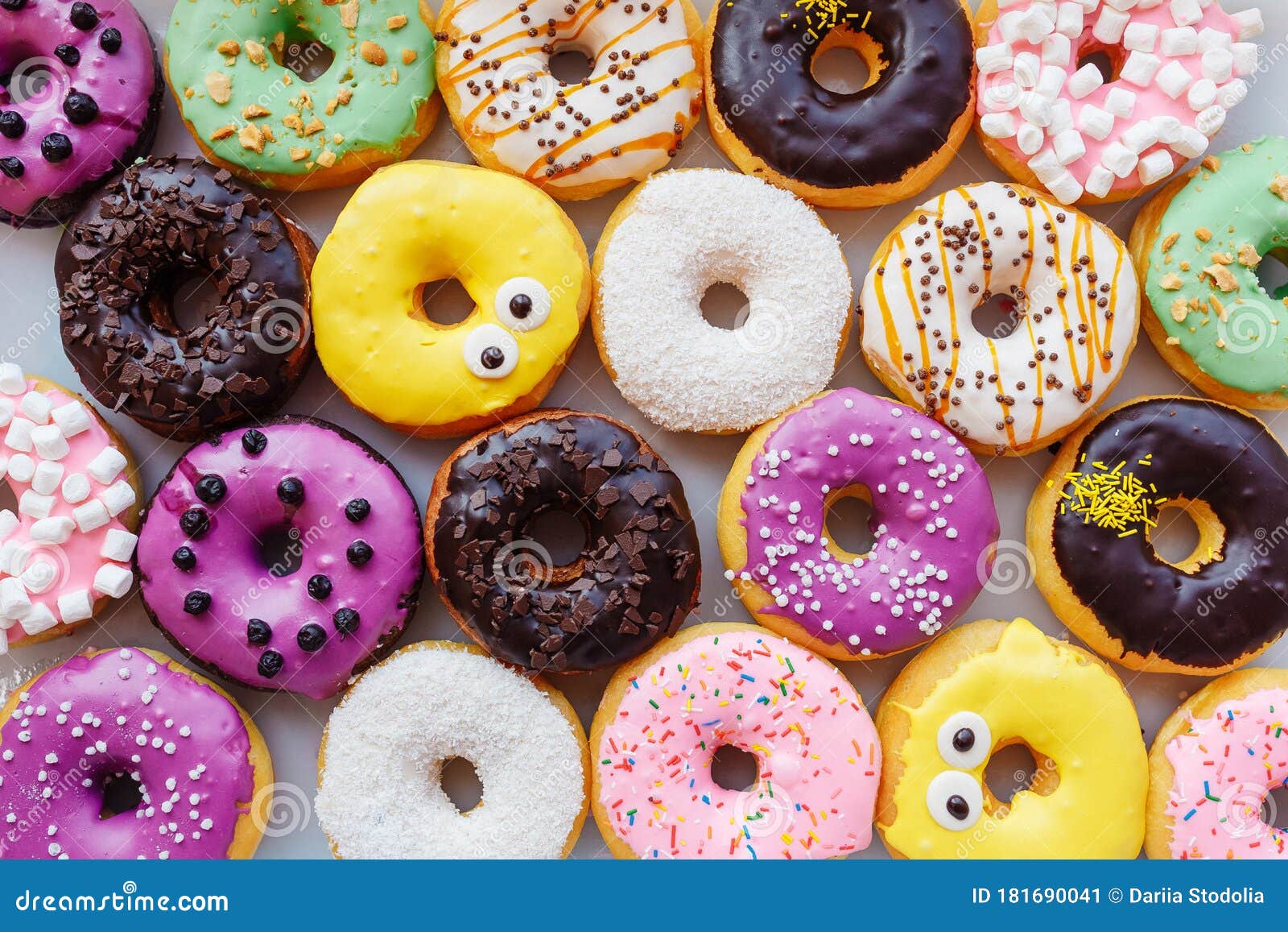 A Lot of Multi-colored Donuts with Different Fillings, Top View Stock ...