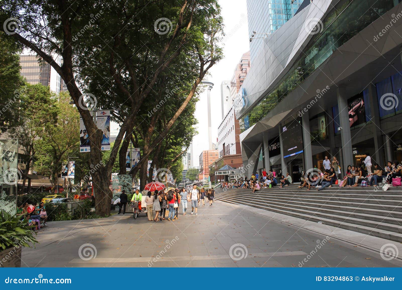 A Lot of People Walking and Sitting in Front of MRT Station in ...