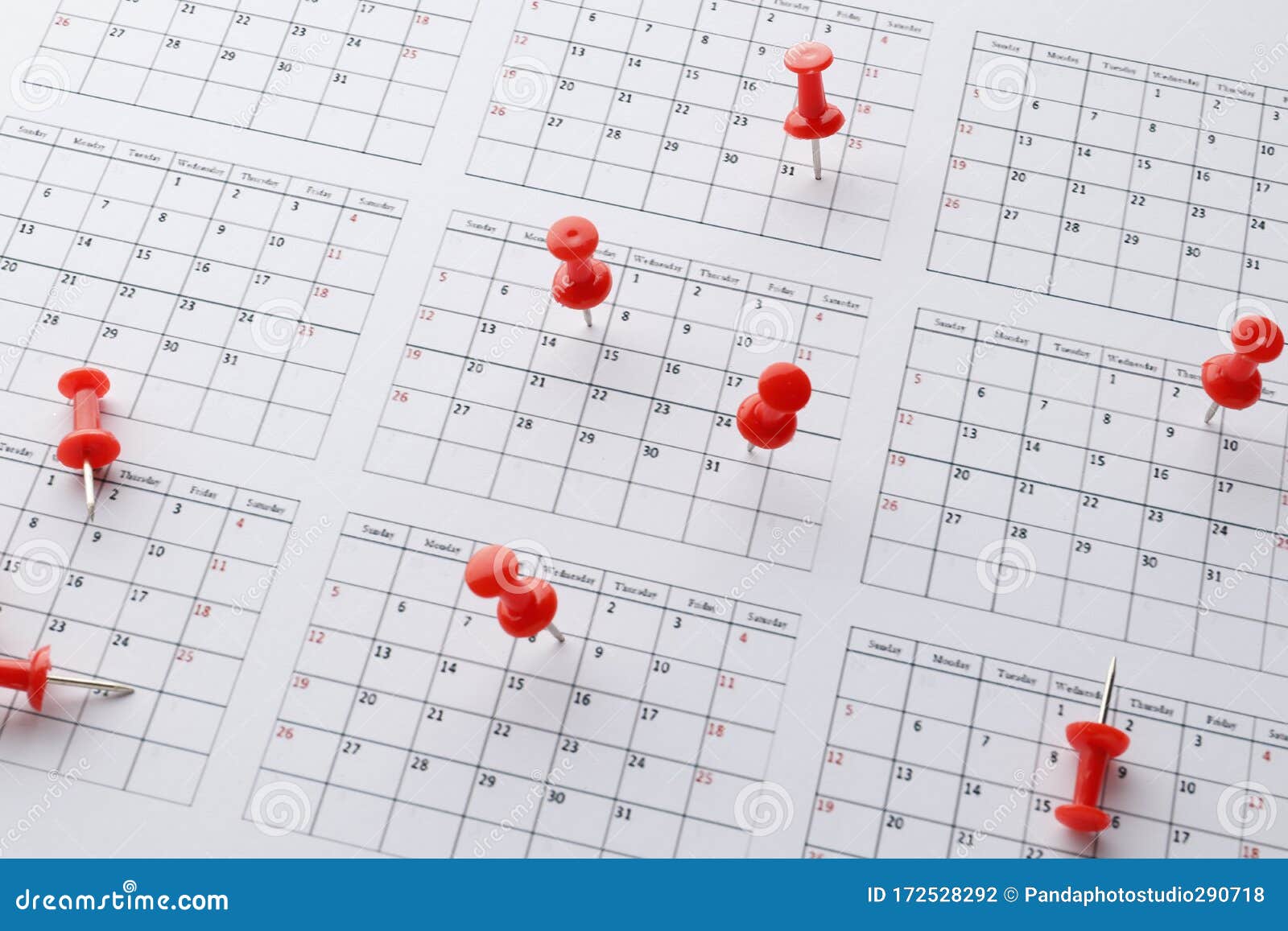 A Lot of Red Pins Marking on Calendar in Planning Stock Photo - Image ...