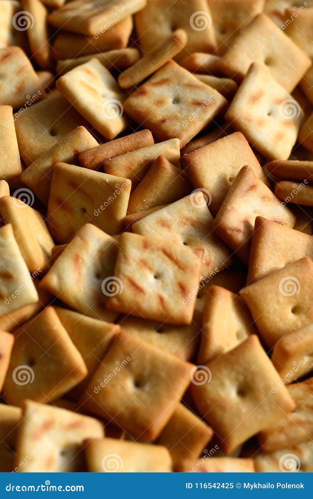 A Lot of Small Cookies are Square Shaped. a Pattern of a Yellow Salt ...