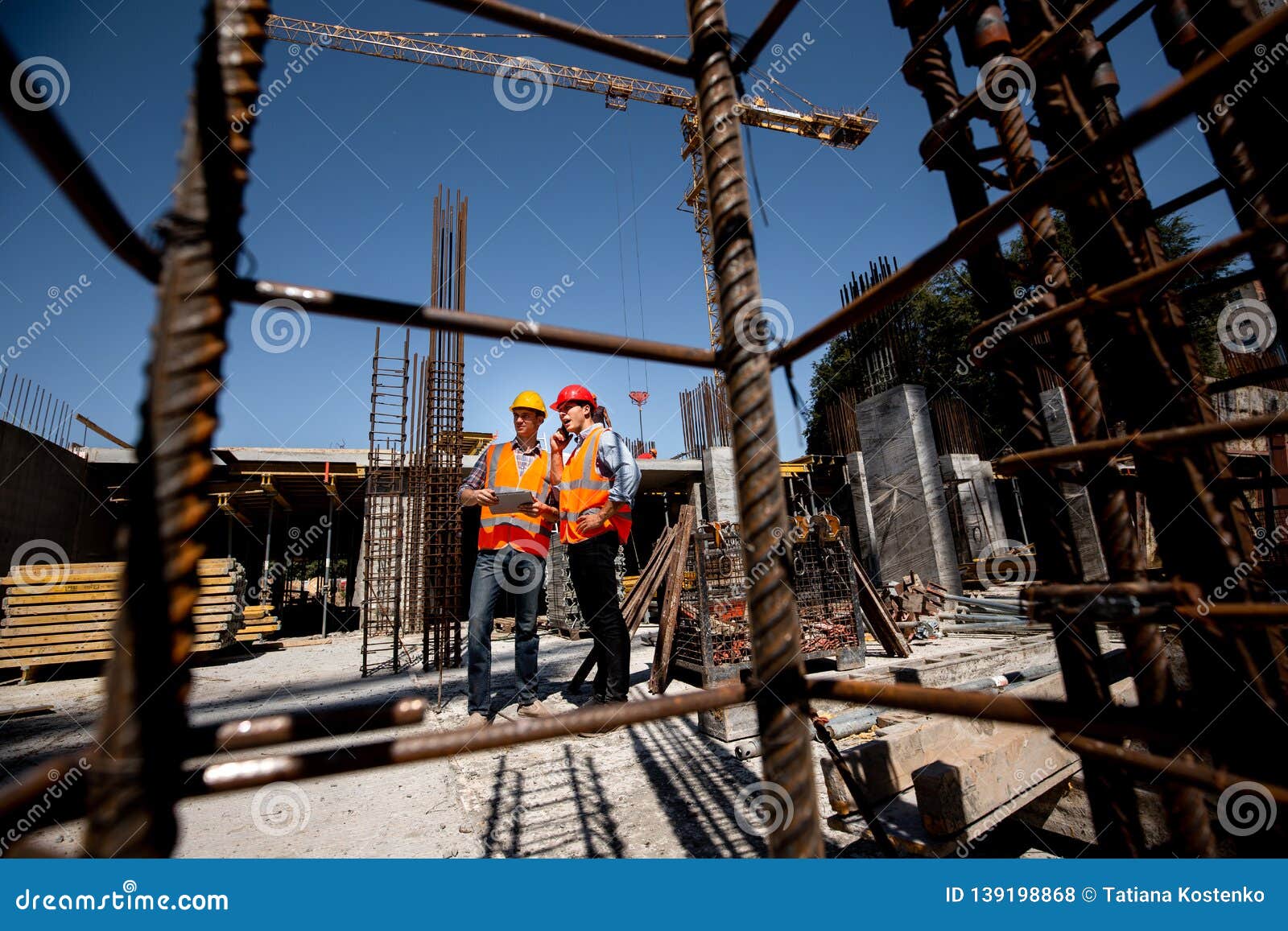 A Lot of Steel Frames. Architect and Structural Engineer in Orange Work ...