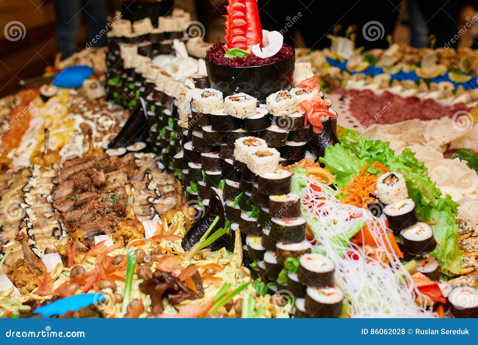 A lot of sushi on a table stock photo. Image of drink - 86062028